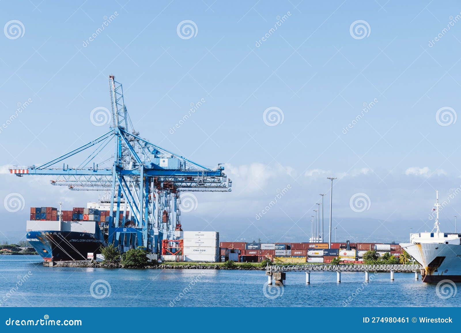 Loading and Unloading Containers on a Cargo Ship. Cranes Lifting Goods ...