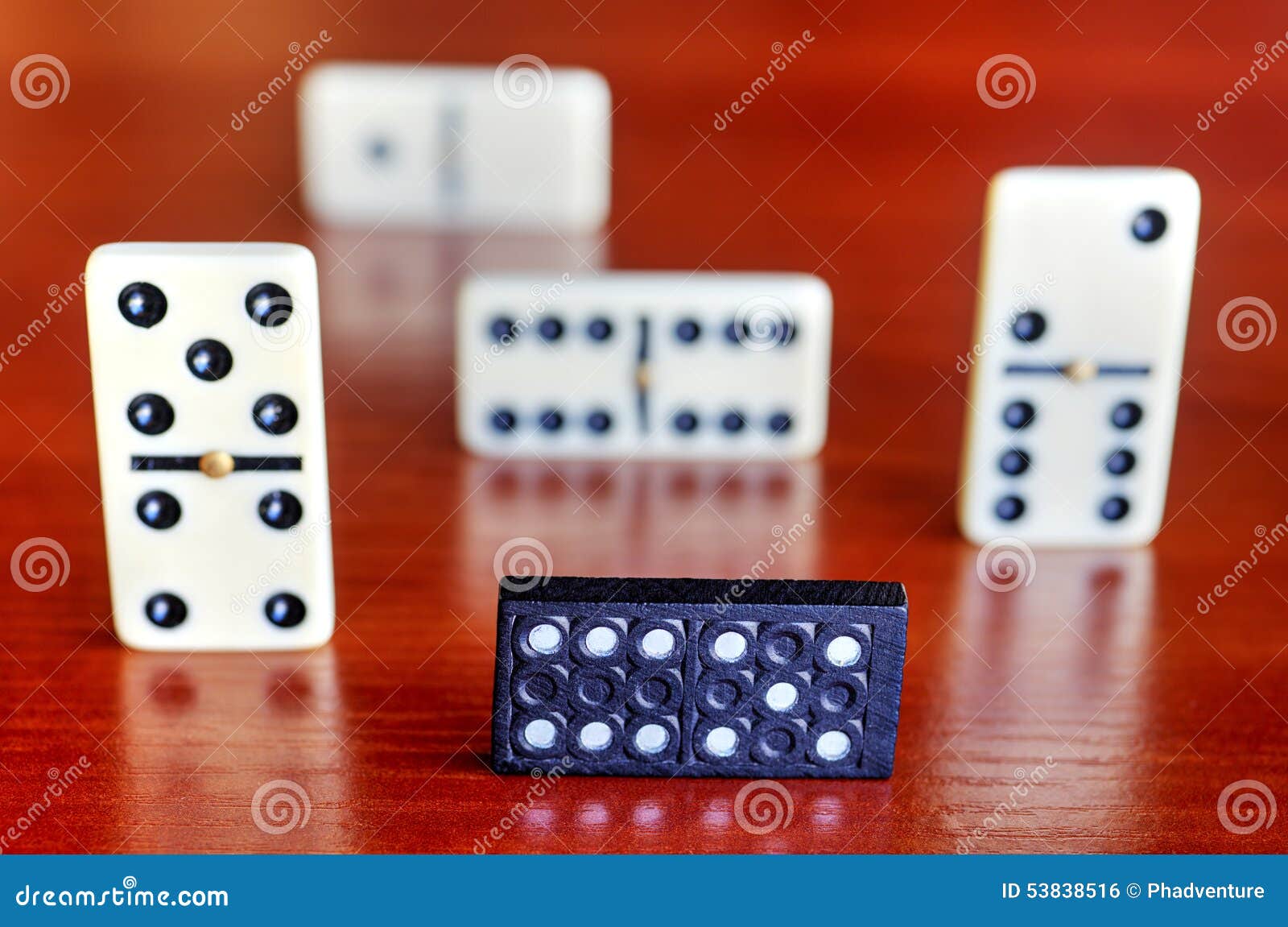 Dominoes on wooden board stock photo. Image of intervention - 53838516
