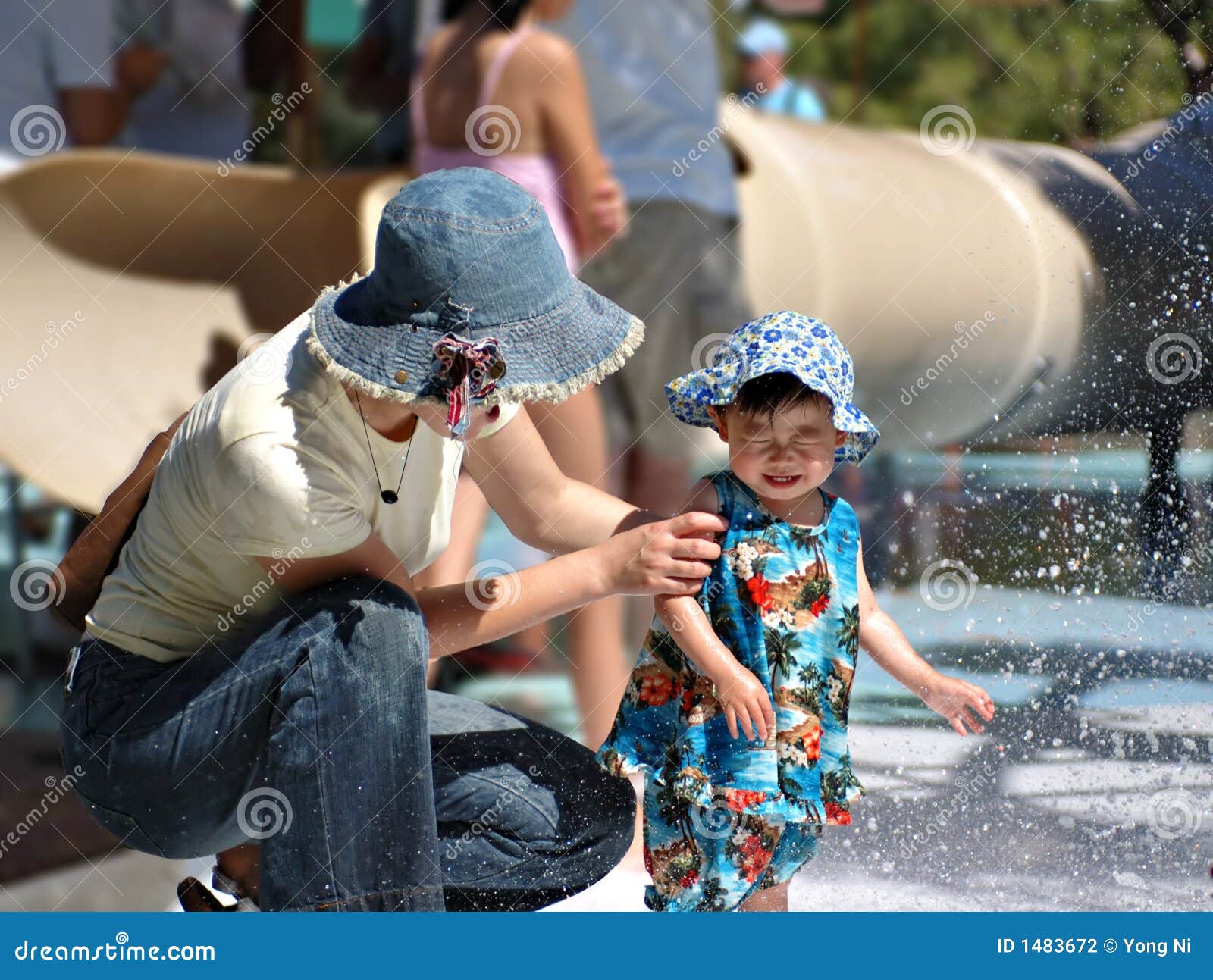 Don t get too wet sweetie stock photo. Image of park, family - 1483672