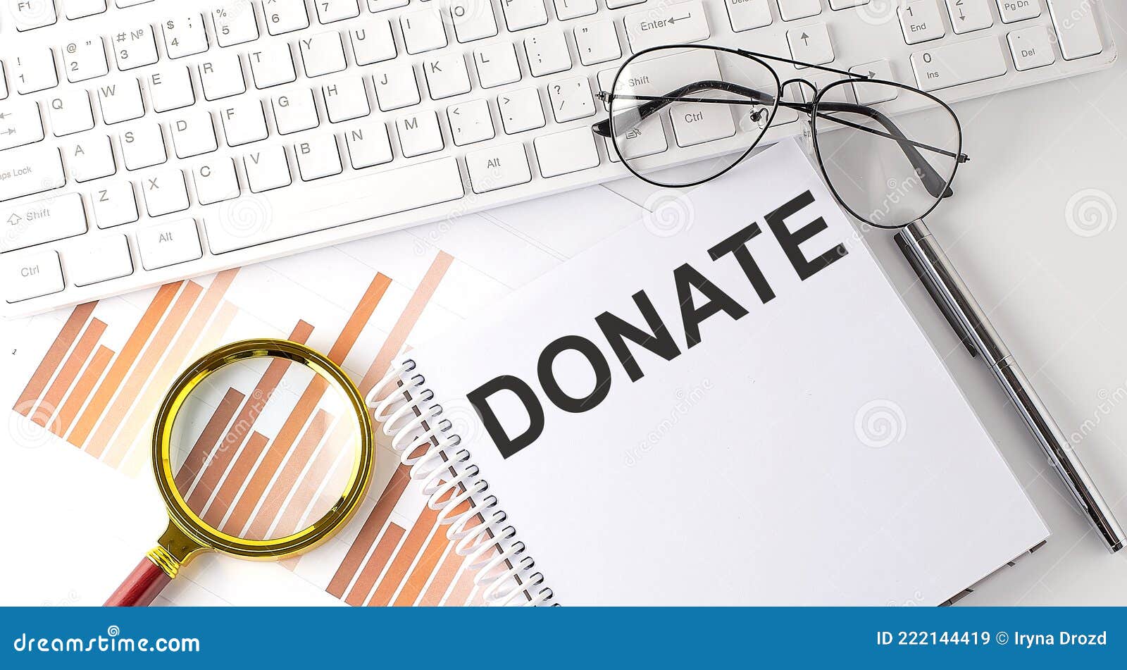 DONATE Text Written on a Notebook with Keyboard, Chart,and Glasses ...