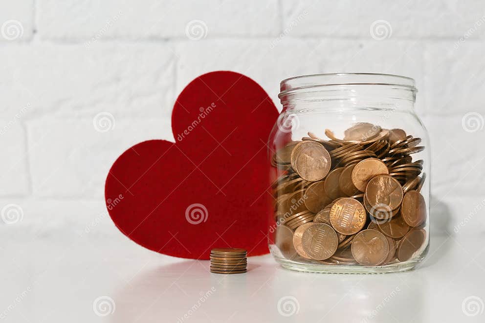 Donation Jar with Coins and Red Heart on Table. Stock Image - Image of ...