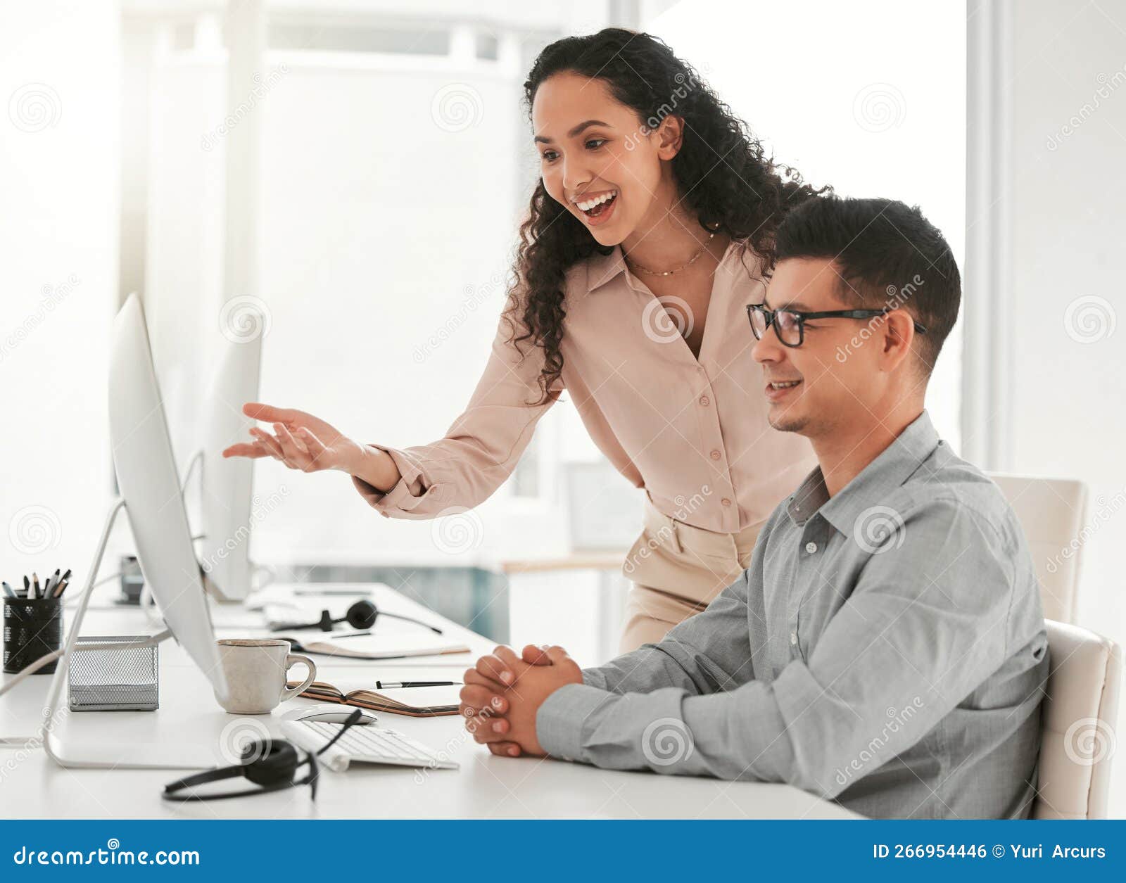 Dont Be Scared To Ask for Help. Two Young Colleagues Using a Computer ...