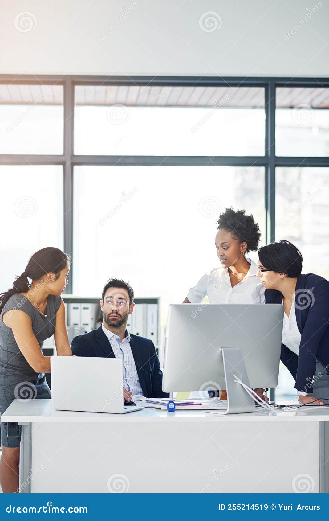 They Dont Look Happy. a Group of Businesspeople Gathered Around a ...