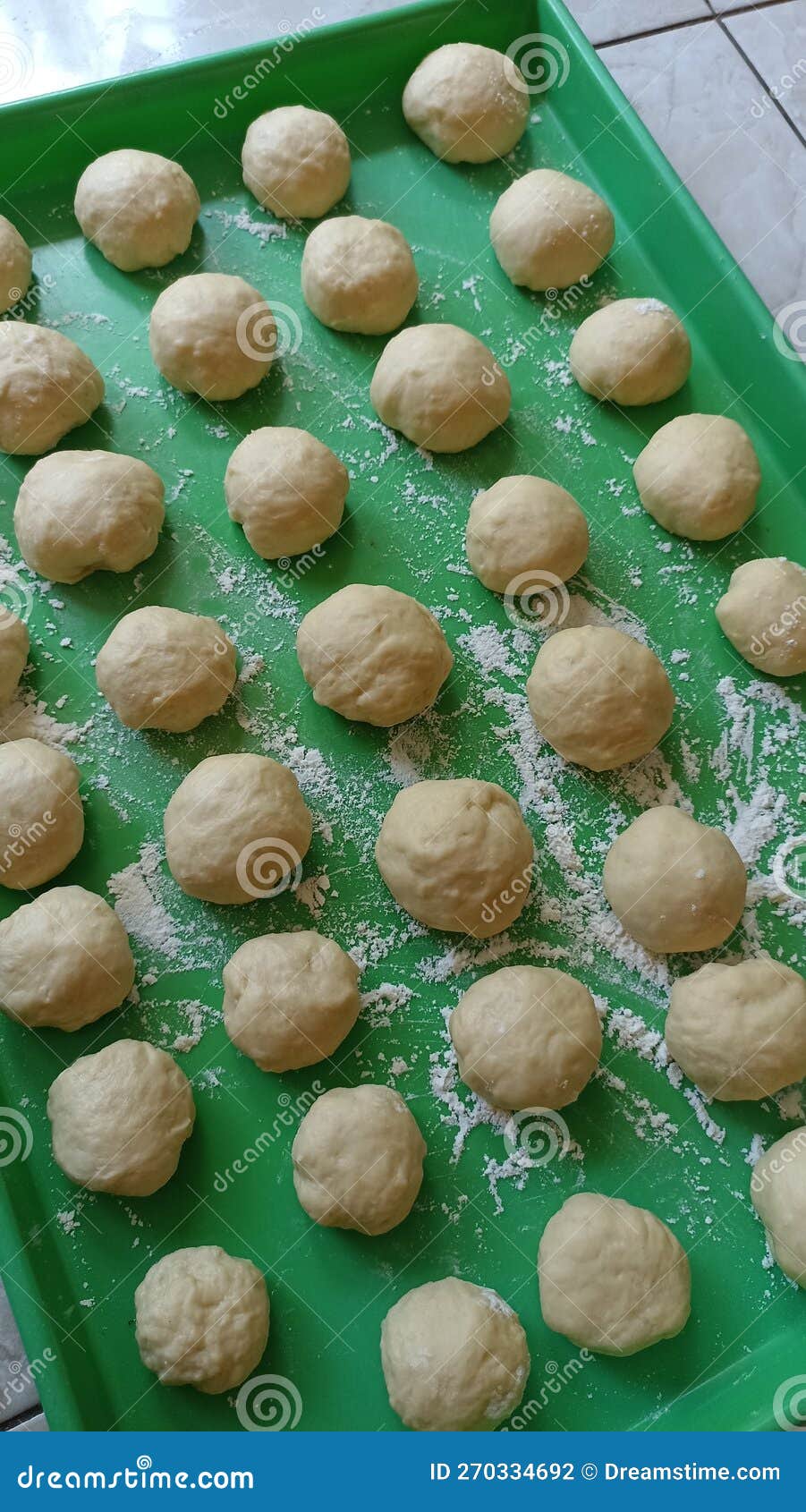 Donut Dough that is Rounded, Waiting To Expand To Be Ready To Be Fried ...