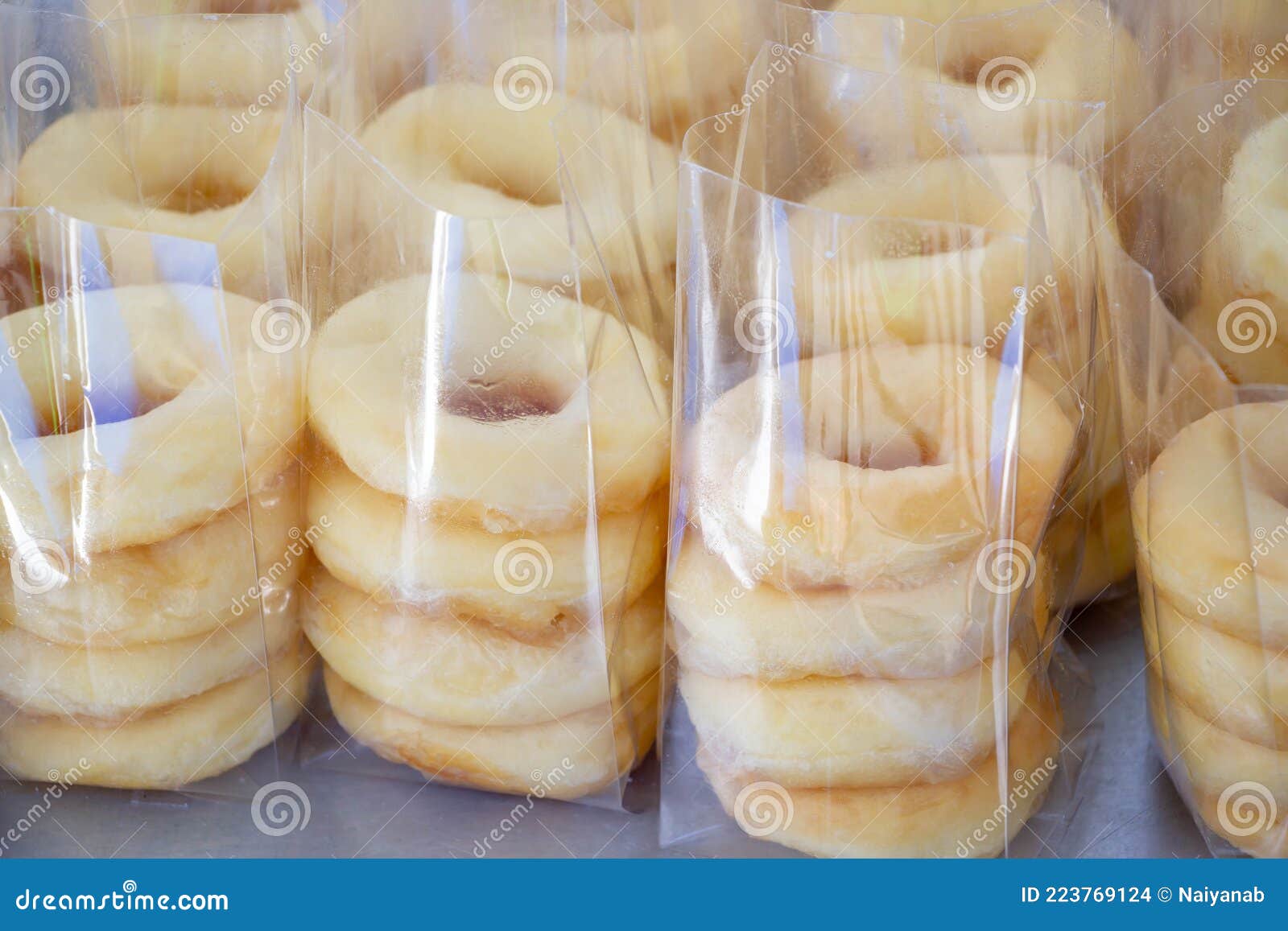 Donut in plastic bag stock photo. Image of dessert, meal - 223769124
