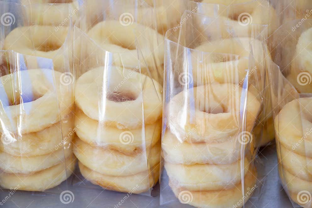 Donut in plastic bag stock photo. Image of dessert, meal - 223769124