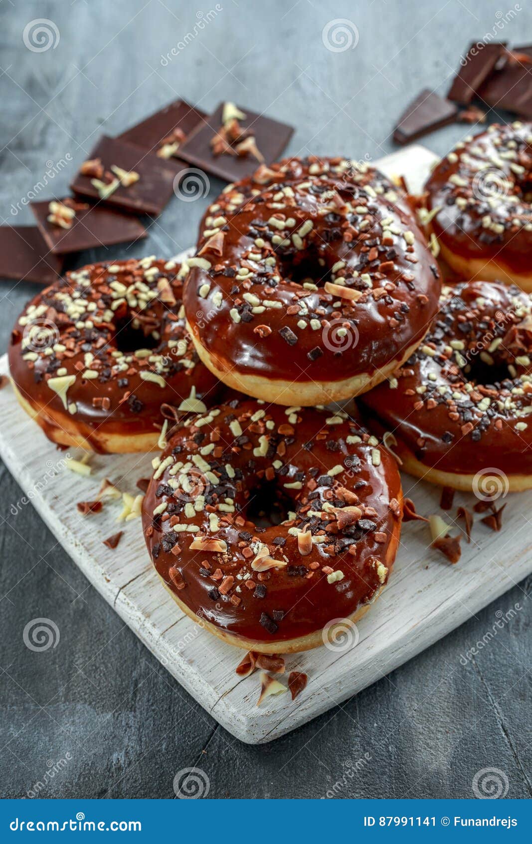 Donut Rings with White and Dark Chocolate Chippings and Icing Served on ...