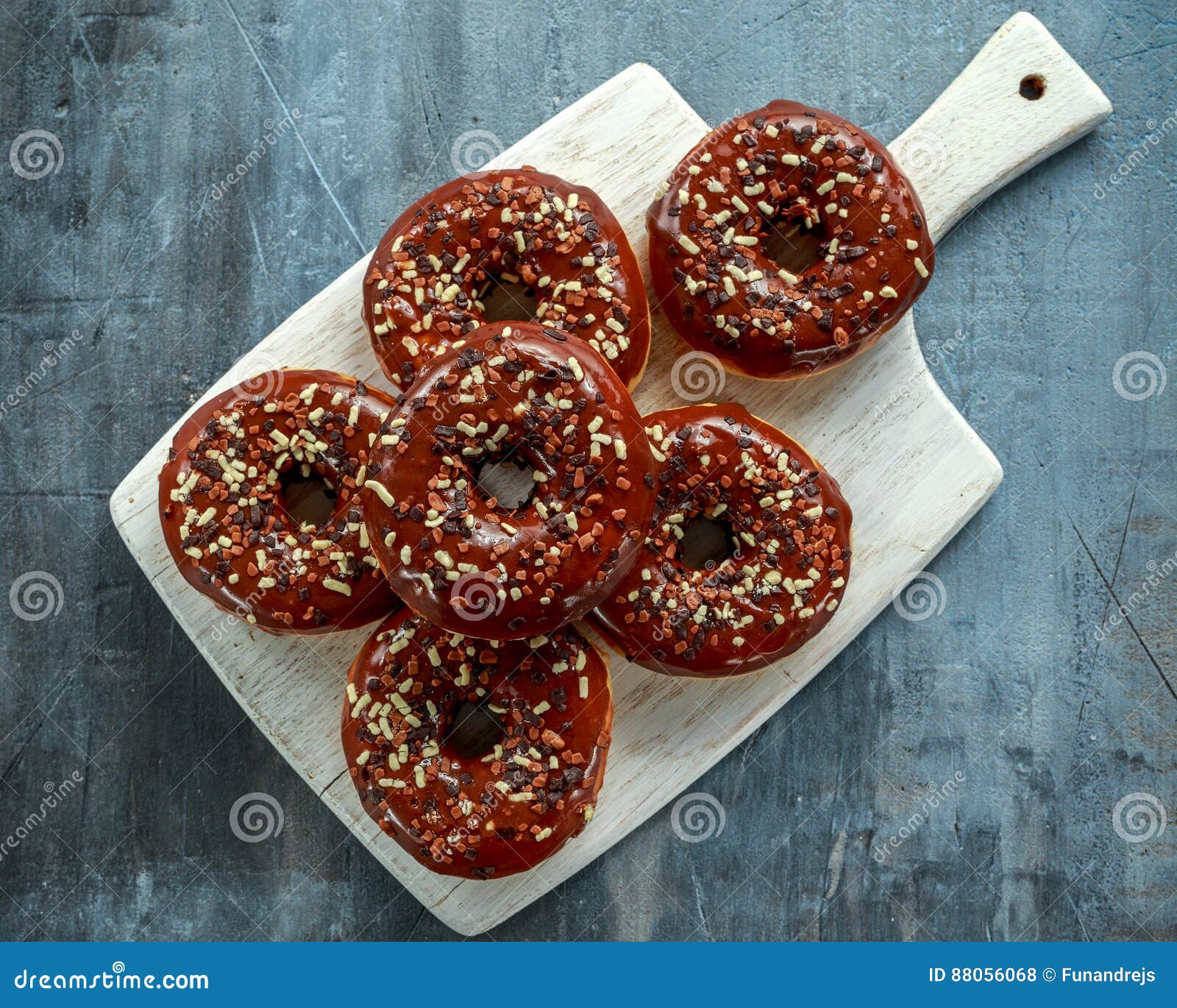 Donut Rings with White and Dark Chocolate Chippings and Icing Served on ...