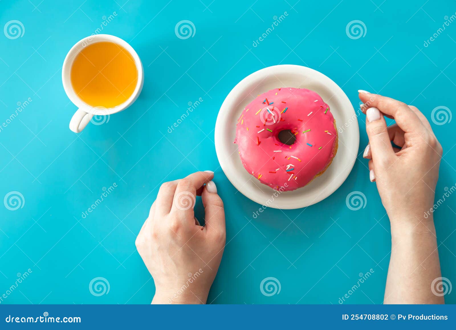 Donut and Tea on a Blue Background, Flat Lay. Stock Photo - Image of ...
