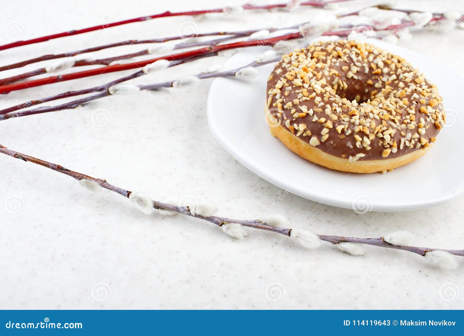 Donut and willow branches. stock image. Image of cake - 114119643