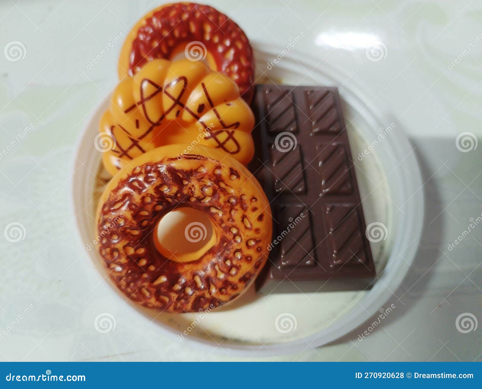 Donuts and Chocolate Bars are a Delicious Array of Toys Stock Photo ...