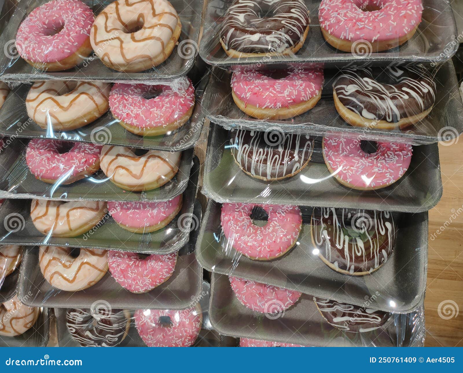 Donuts with Chocolate and Multi Colored Donuts with Sprinkles Stock ...