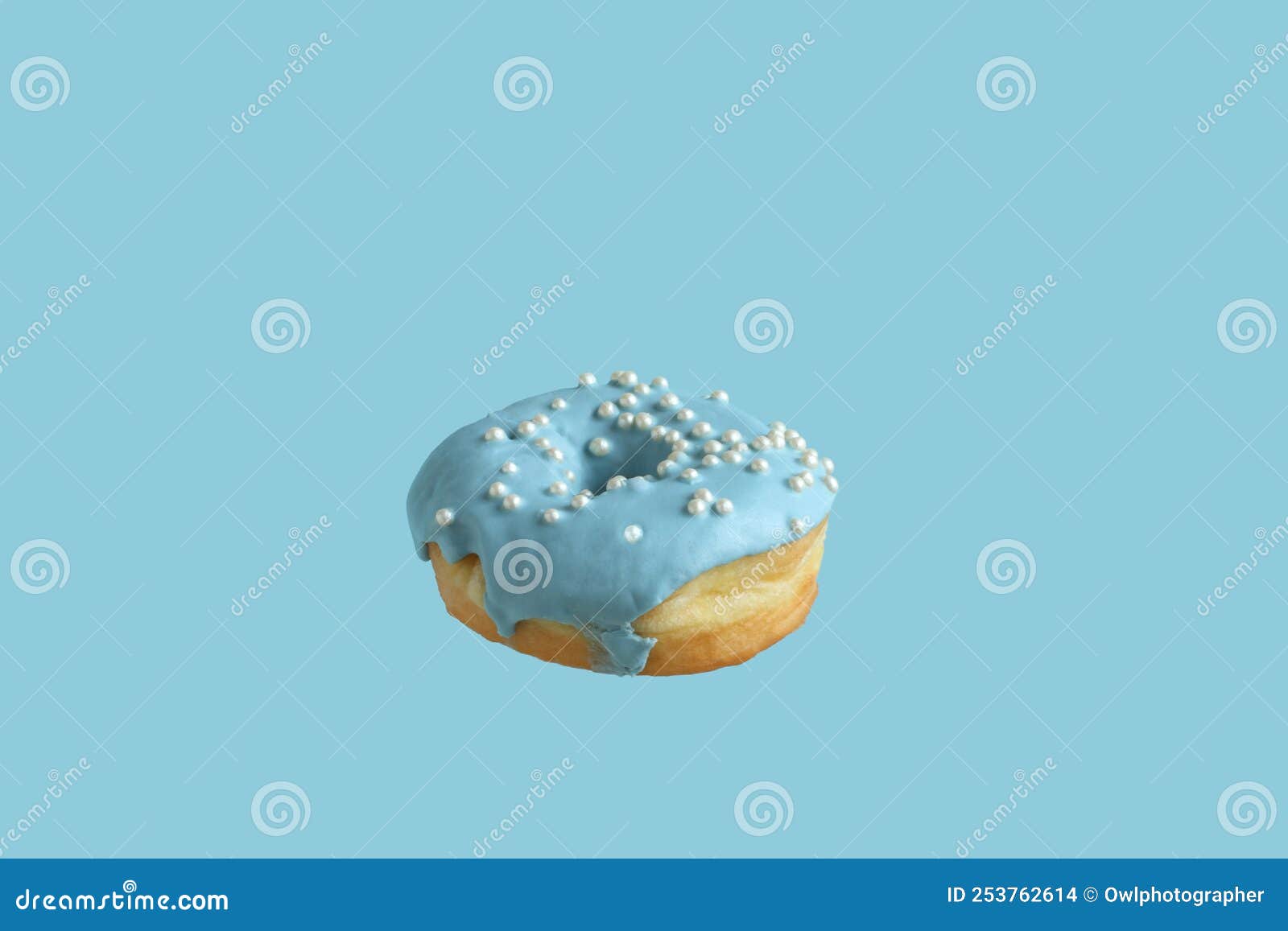 Donuts Covered with Pale Blue Icing and Sprinkled with Pearl Sugar ...