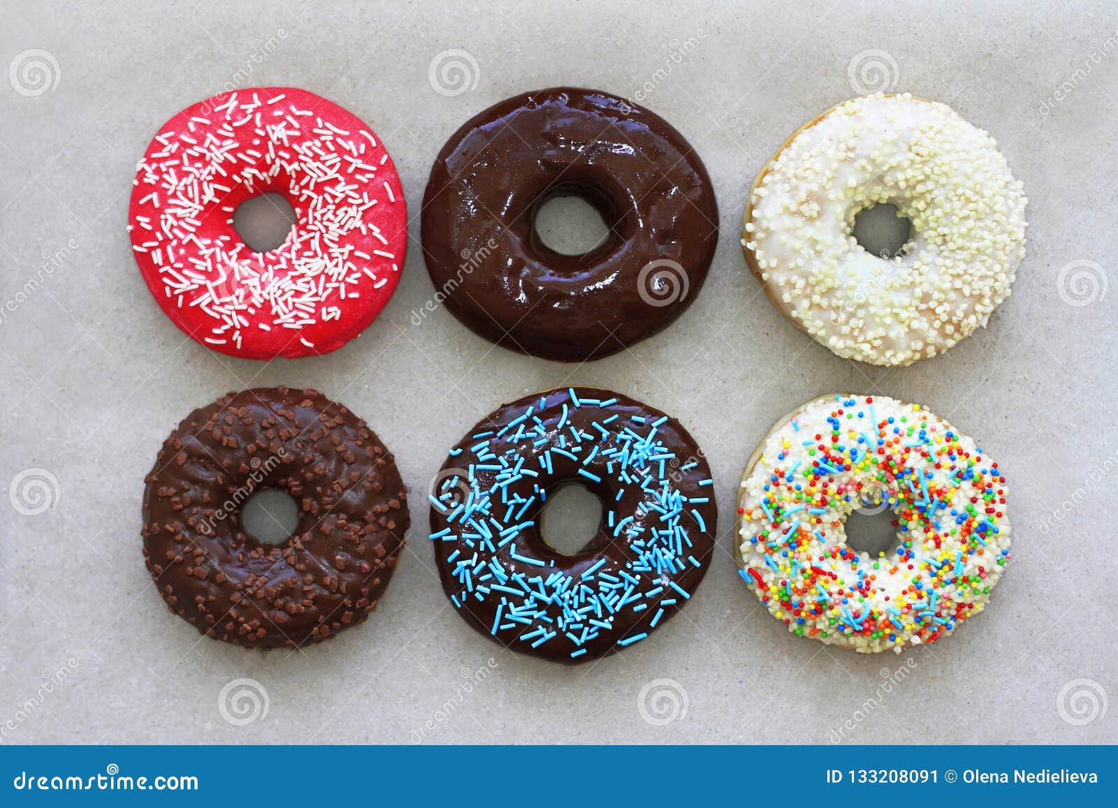 Donuts of Different Colors on Cardboard, Top View Stock Image - Image ...