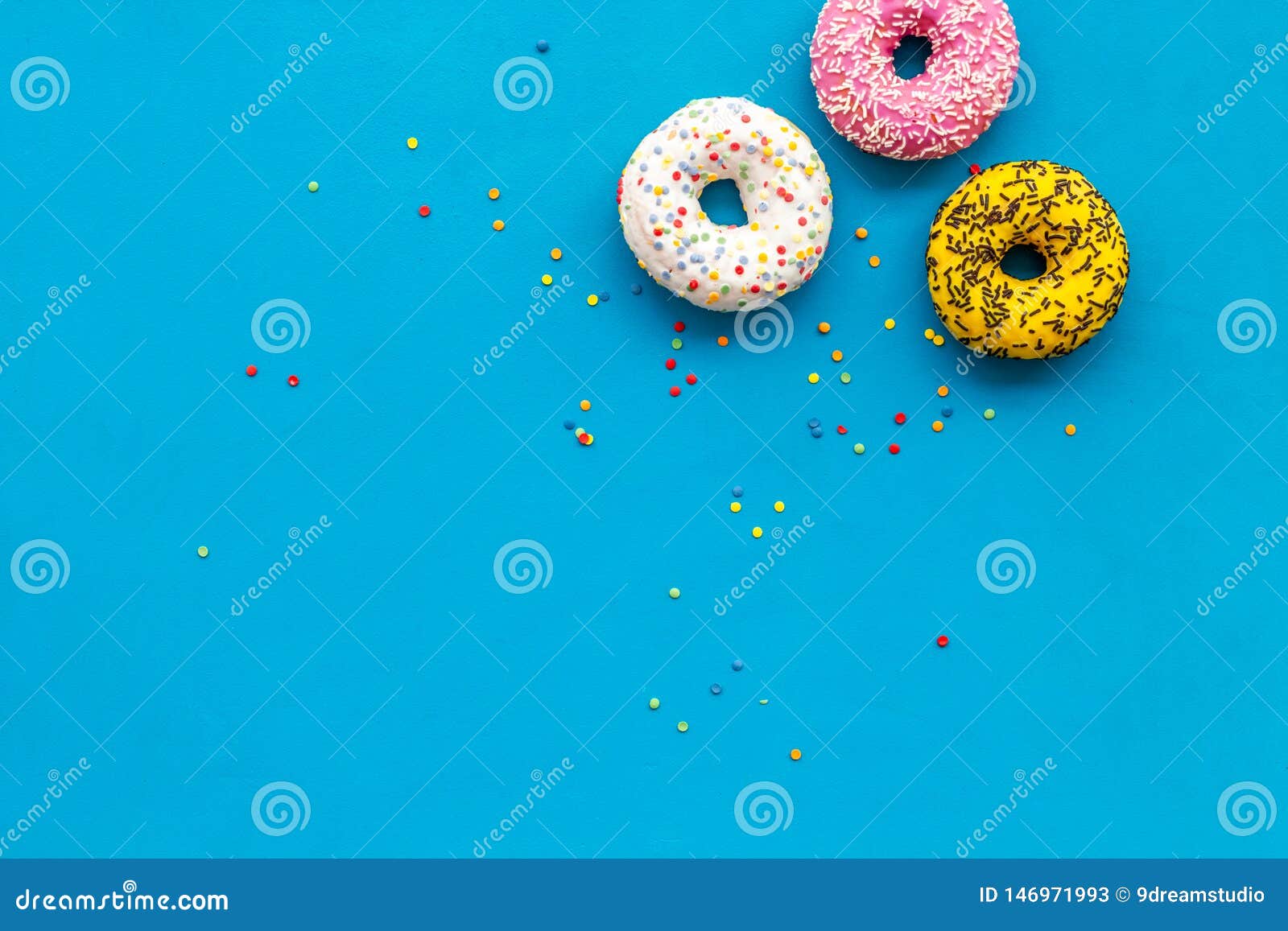 Donuts of Different Flavors for Breakfast on Blue Background Top View ...