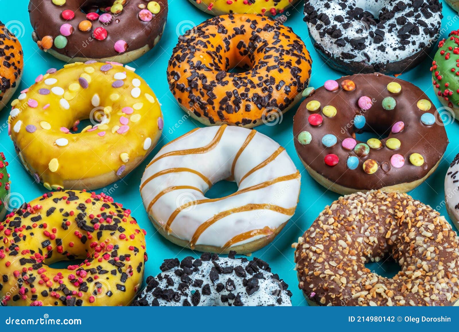 Donuts with Different Flavors of Icing on a Blue Stock Photo - Image of ...