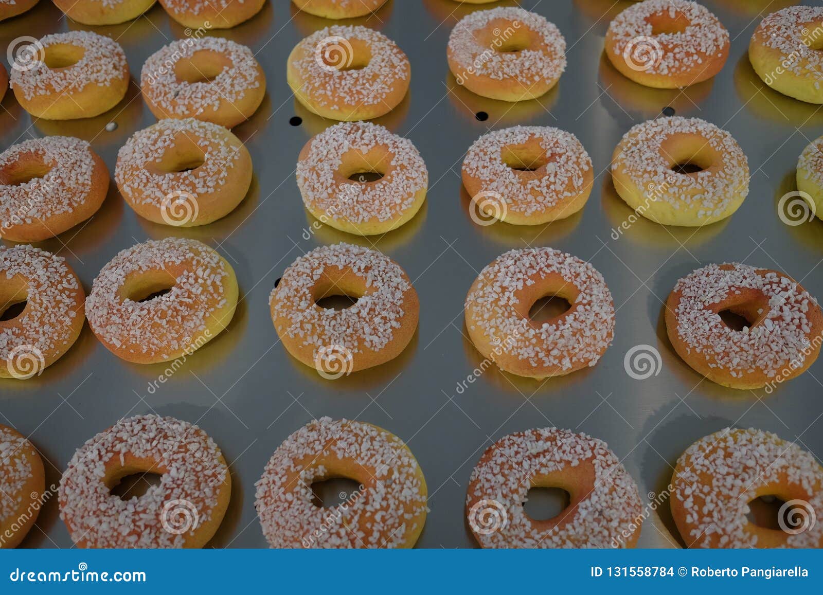 Donuts inside the pan stock photo. Image of donuts, round - 131558784