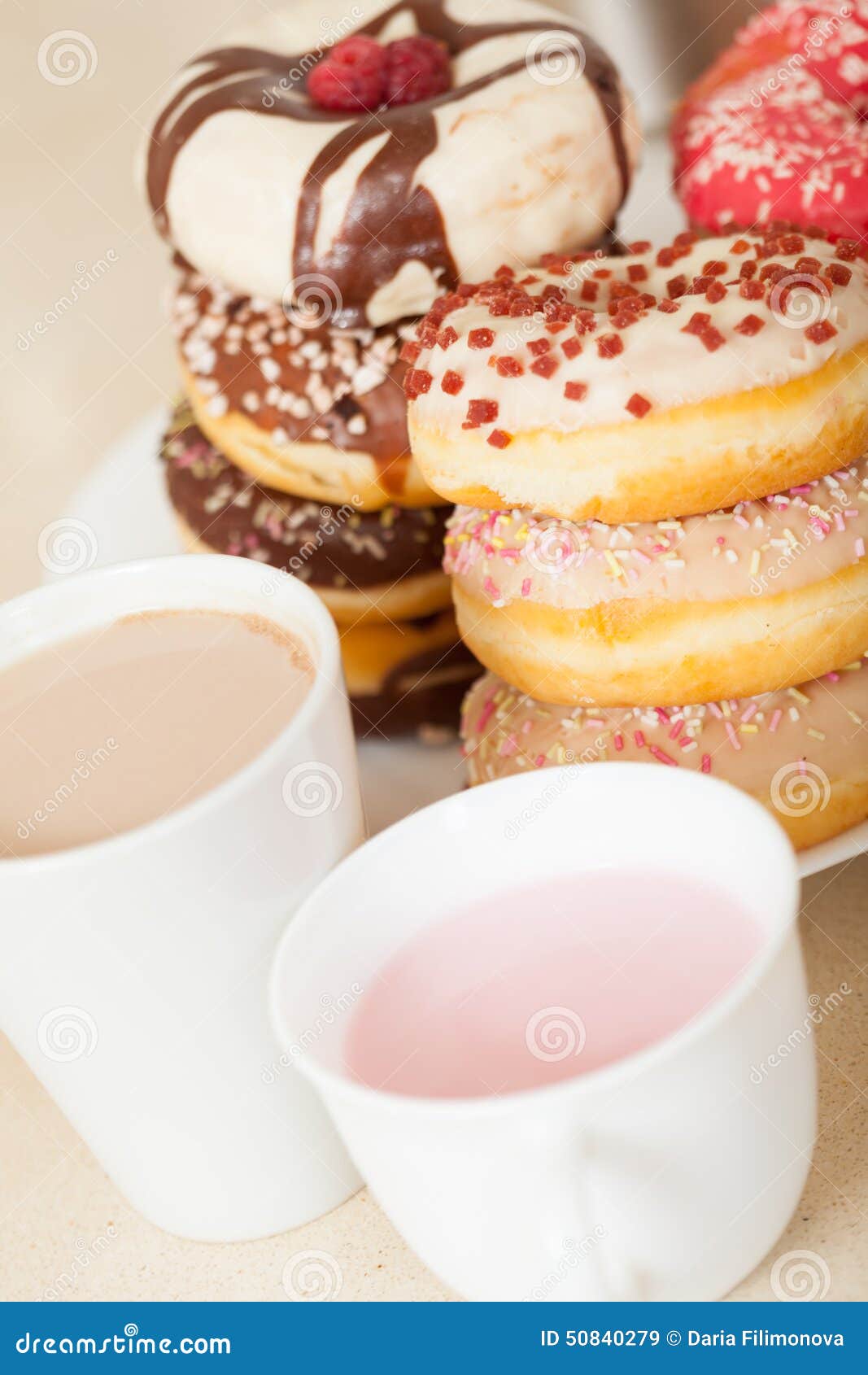 Donuts on plate with cups stock image. Image of bakery - 50840279