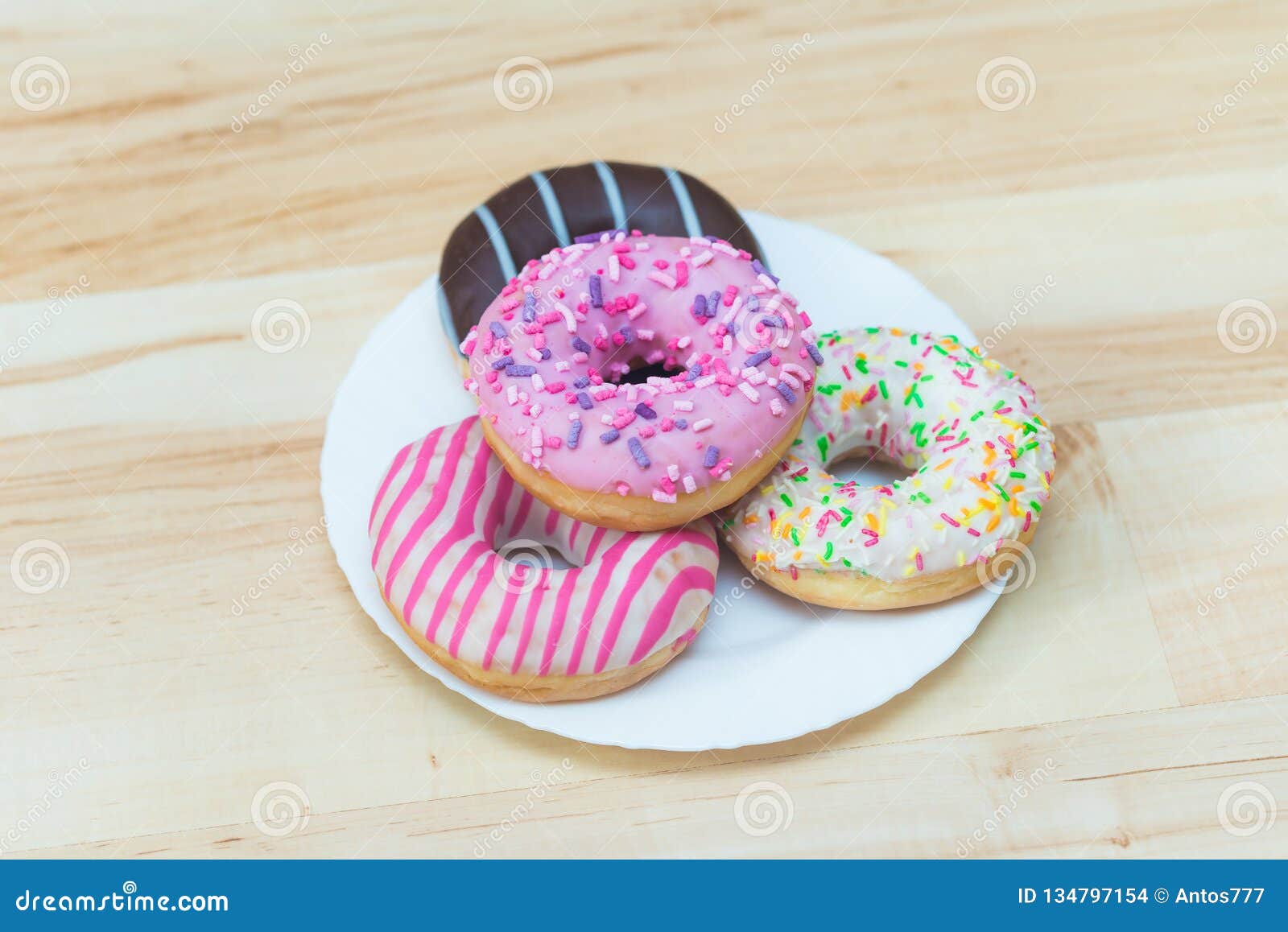 Donuts on a plate stock photo. Image of culinary, doughnut - 134797154