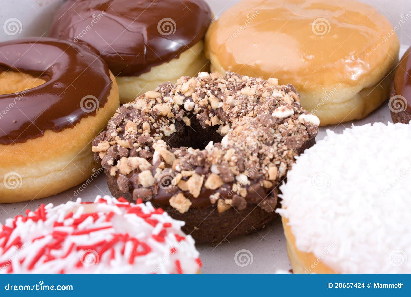 Donuts in rows stock photo. Image of sweet, caramel, iced - 20657424