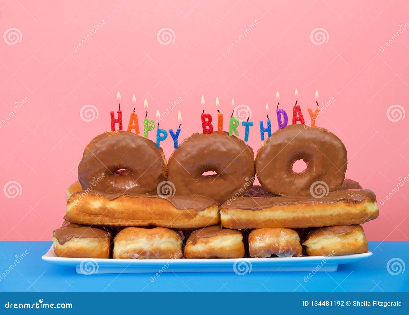 Donuts Stacked on a Rectangular Plate Birthday Cake Out of Donuts Stock ...