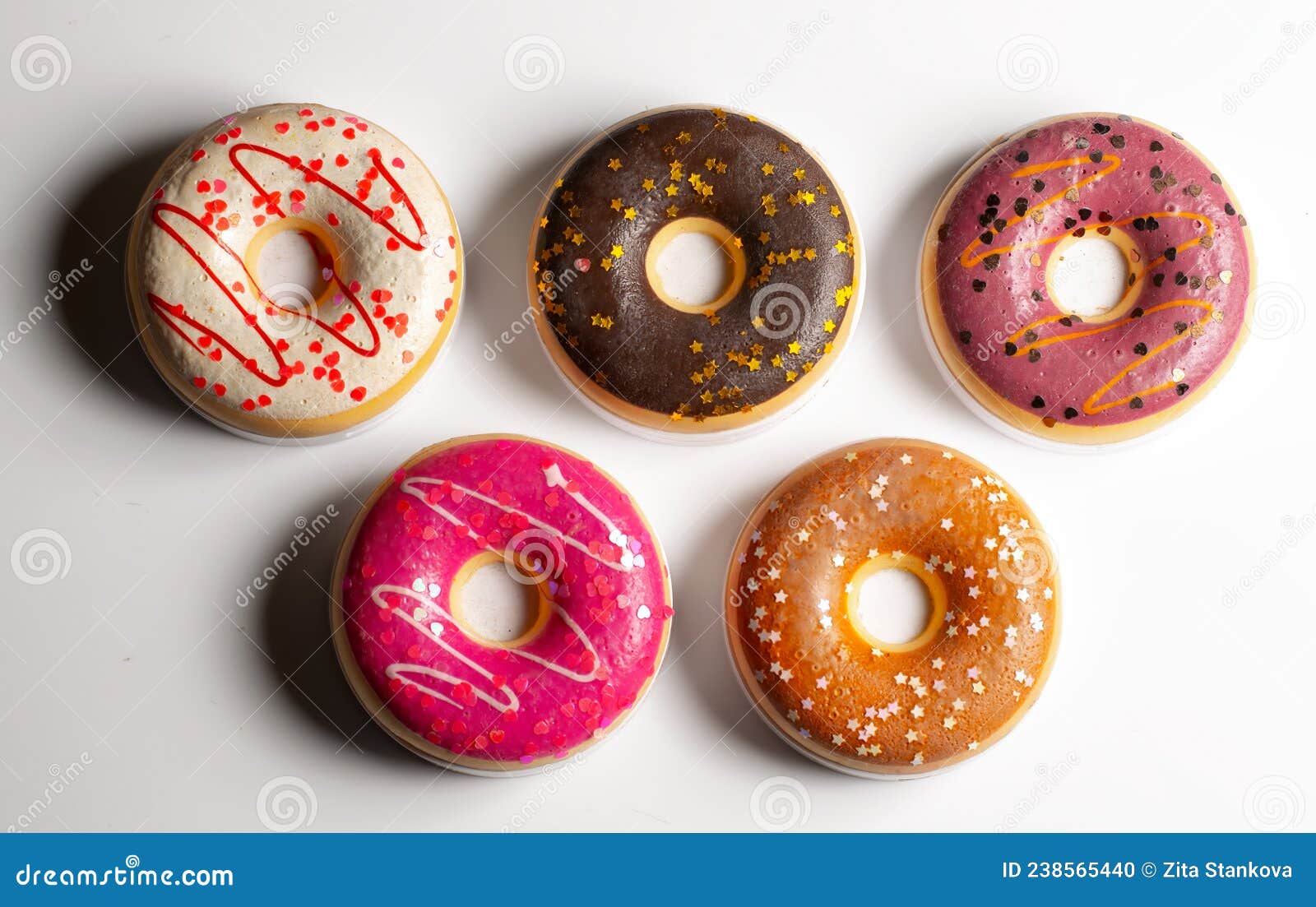 Various Coloured Doughnuts on a White Background Stock Photo - Image of ...