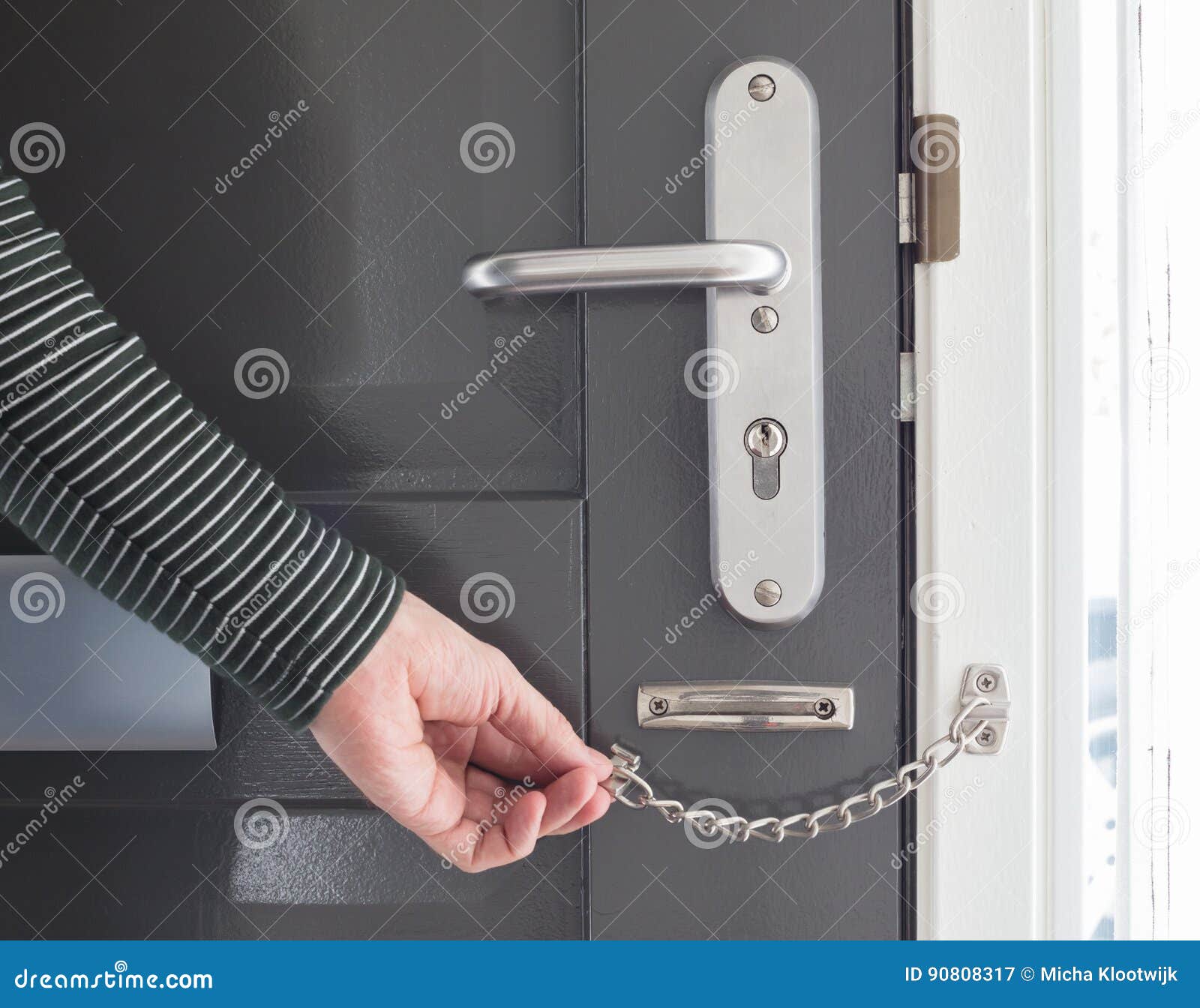 Door chain on a grey door stock image. Image of lock - 90808317