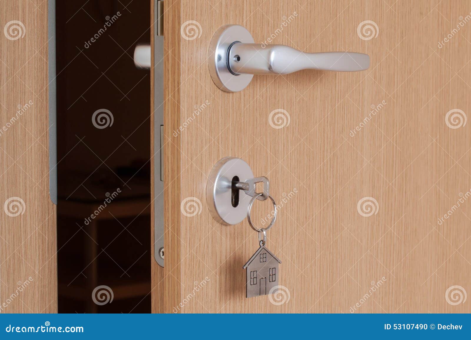 Door Handle with Inserted Key with House Icon Keyring Stock Photo ...