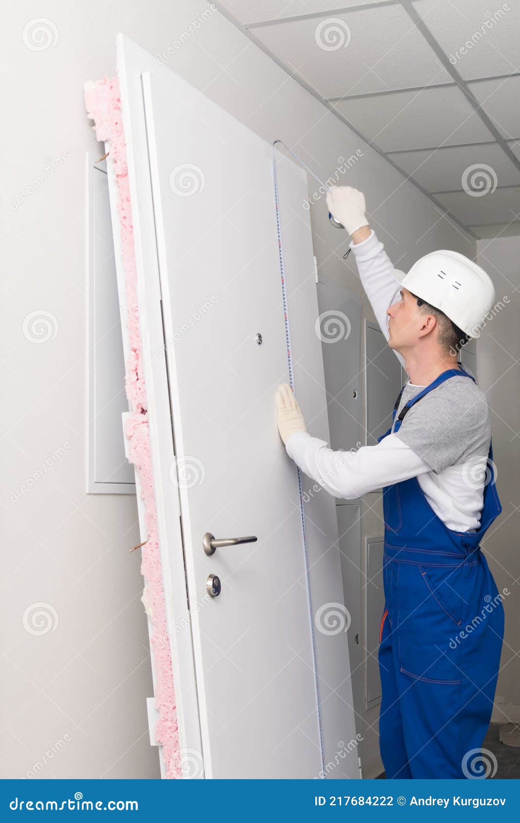 Door Installation Worker Measures Door Height Stock Photo - Image of ...