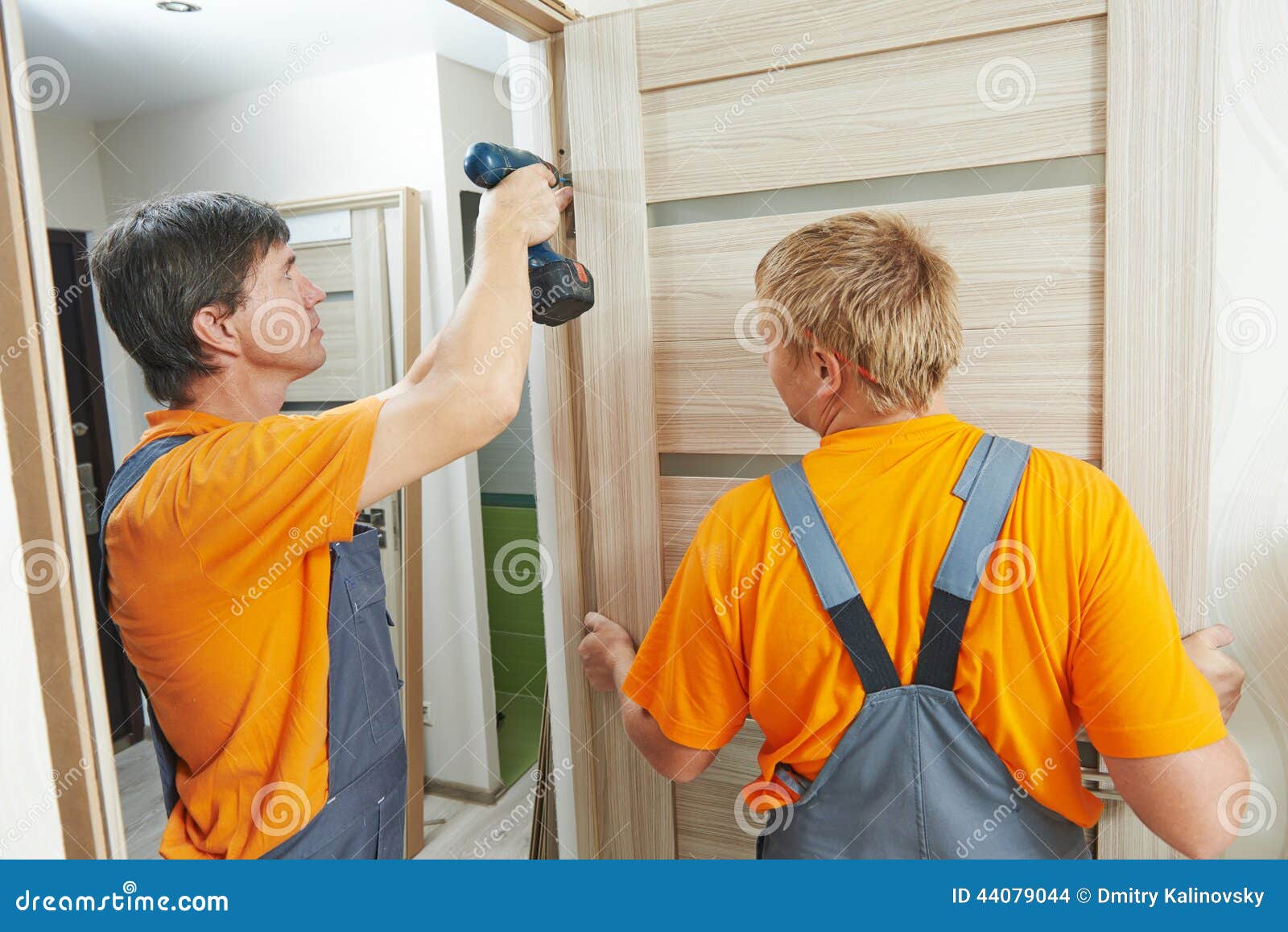 Door installation workers stock photo. Image of hinge - 44079044