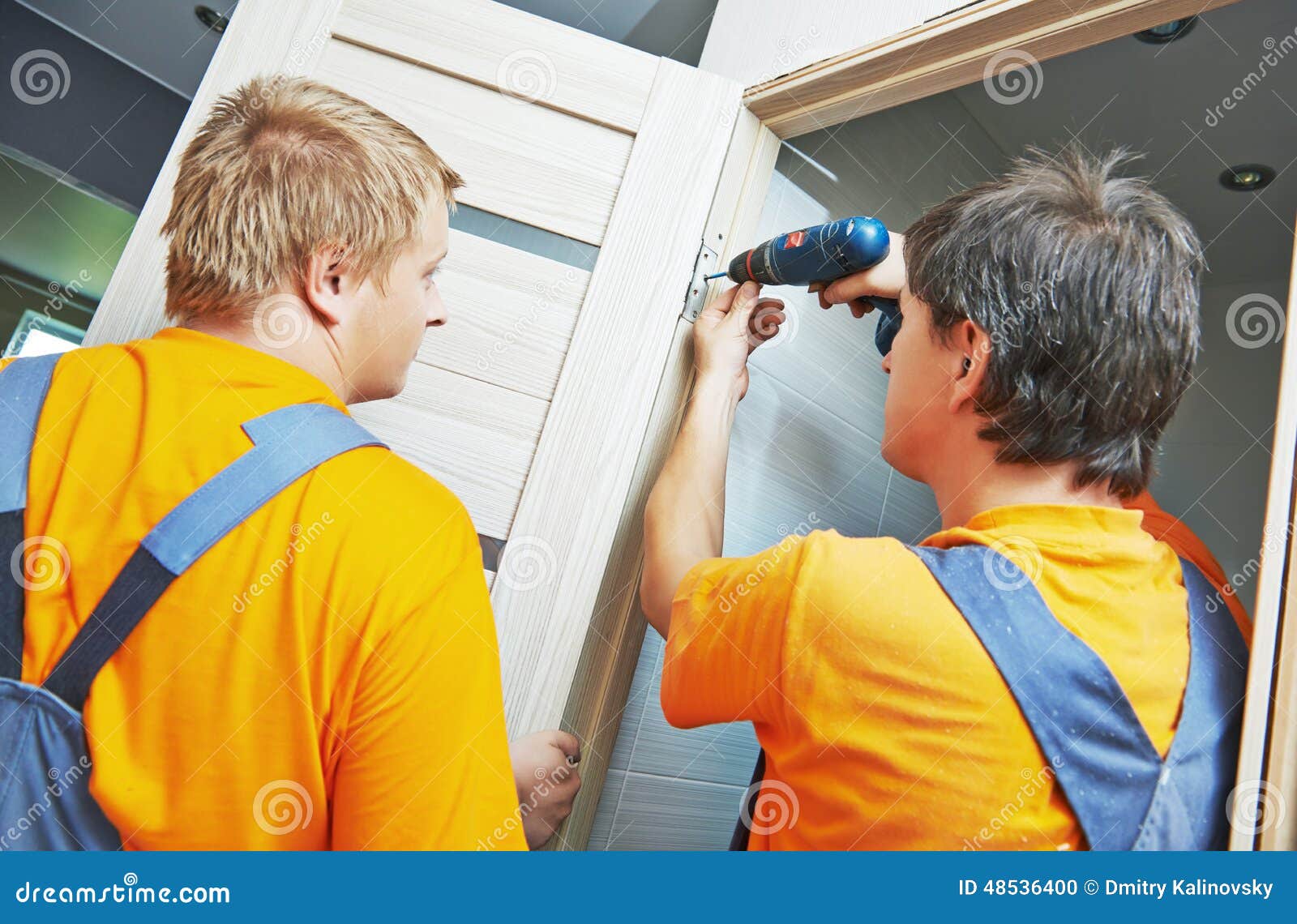 Door installation workers stock photo. Image of person - 48536400