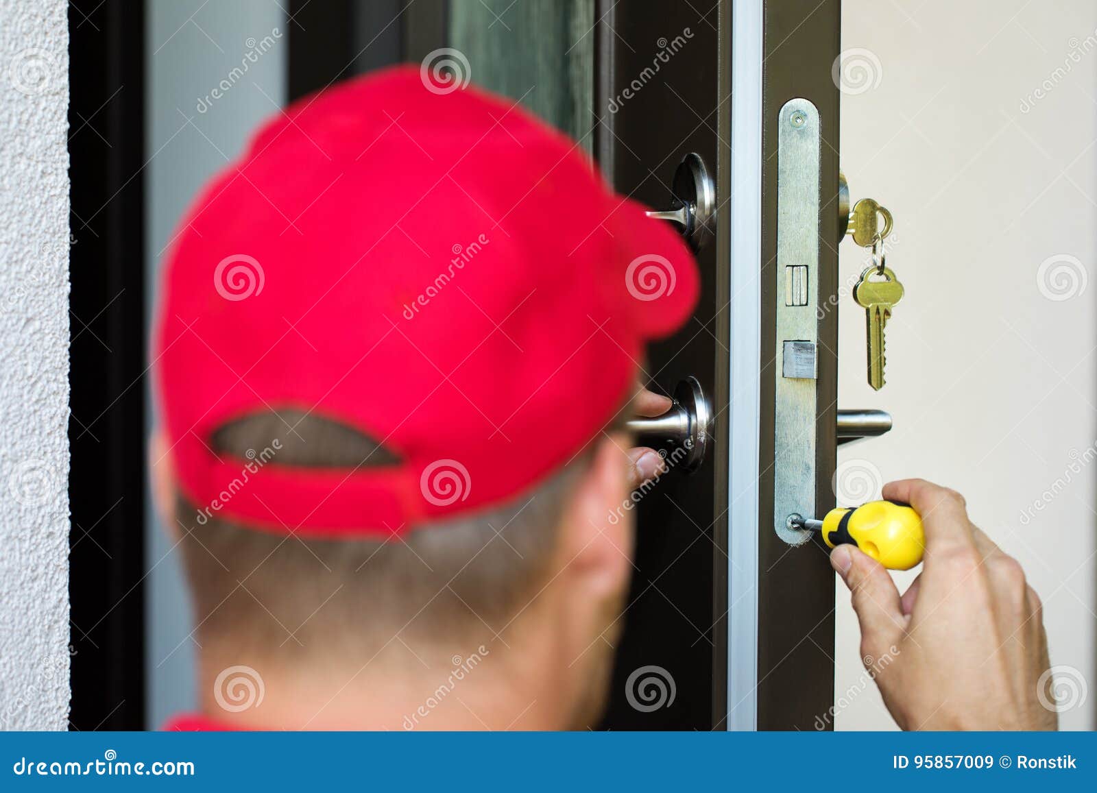 Door Lock Service - Locksmith Working with Screwdriver Stock Image ...