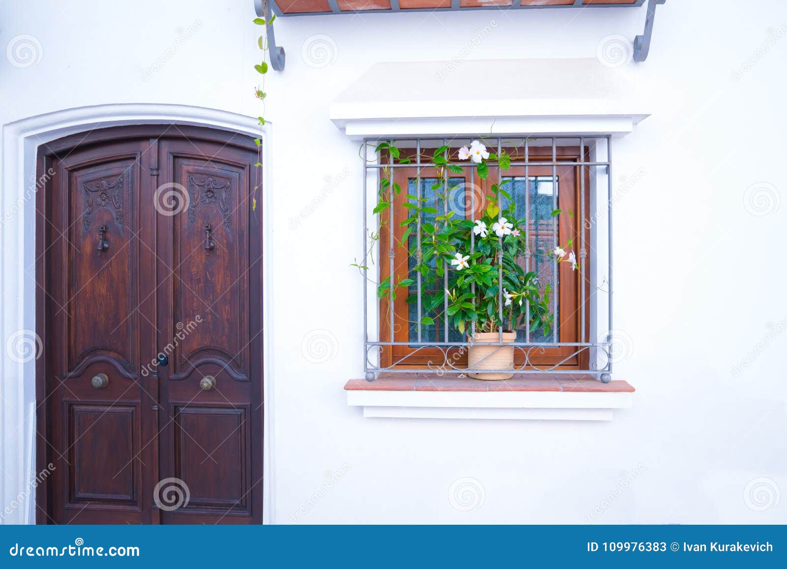 A Door and a Window Decorated with Flowers Stock Image - Image of ...