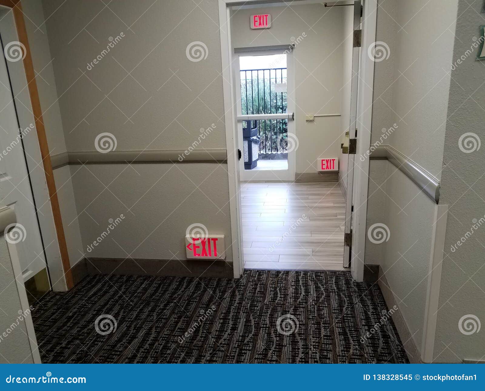 Doors and Three Red Exit Signs in Building Stock Image - Image of door ...