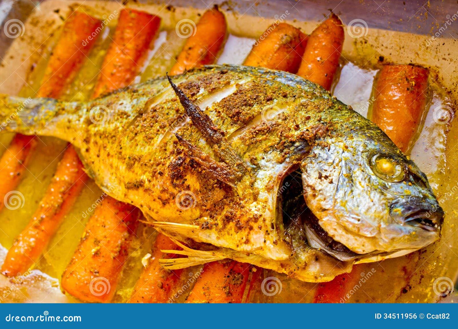Dorade with Curry on Carrots in Oriental Style Stock Photo - Image of ...