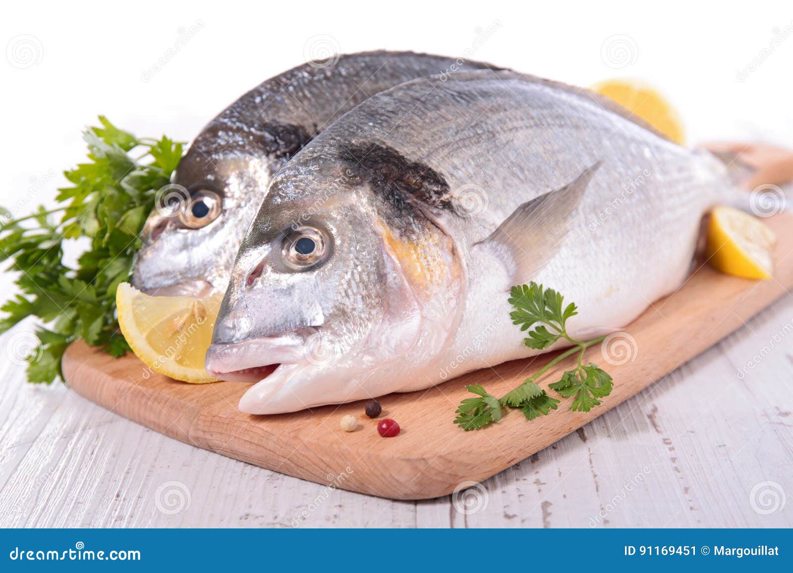 Dorado fish stock image. Image of cuisine, board, seafood - 91169451