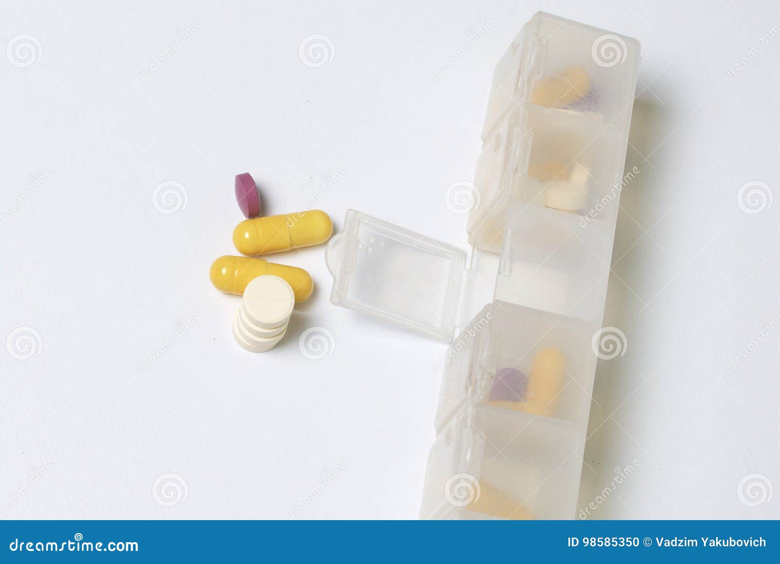 A daily Dose of Tablets Lies Near a Special Container for daily ...