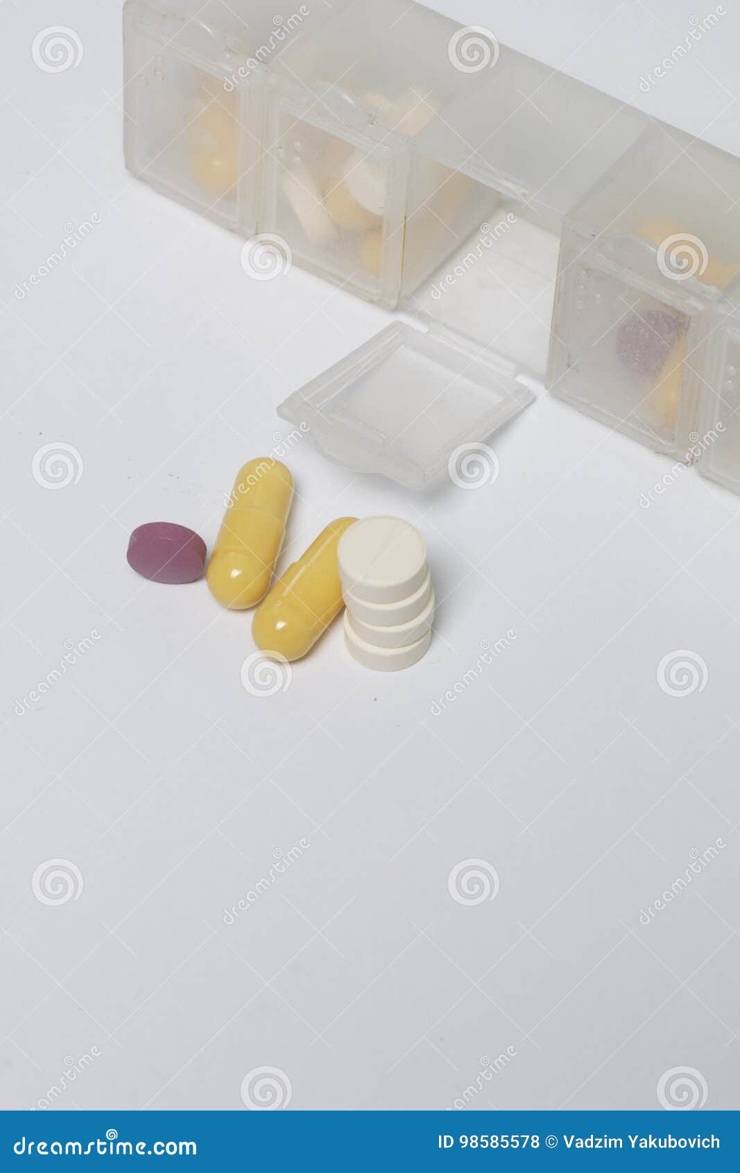 A daily Dose of Tablets Lies Near a Special Container for daily ...