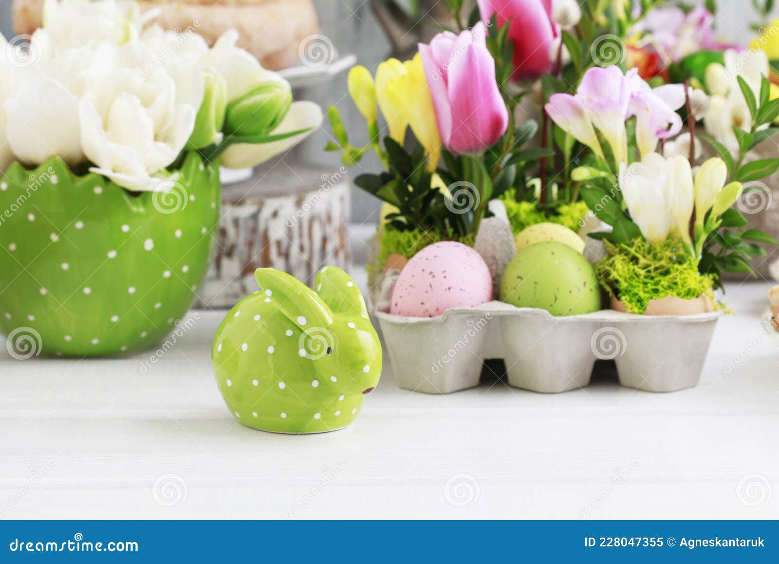 Dotted Green Ceramic Rabbit and Floral Decoration in the Background ...