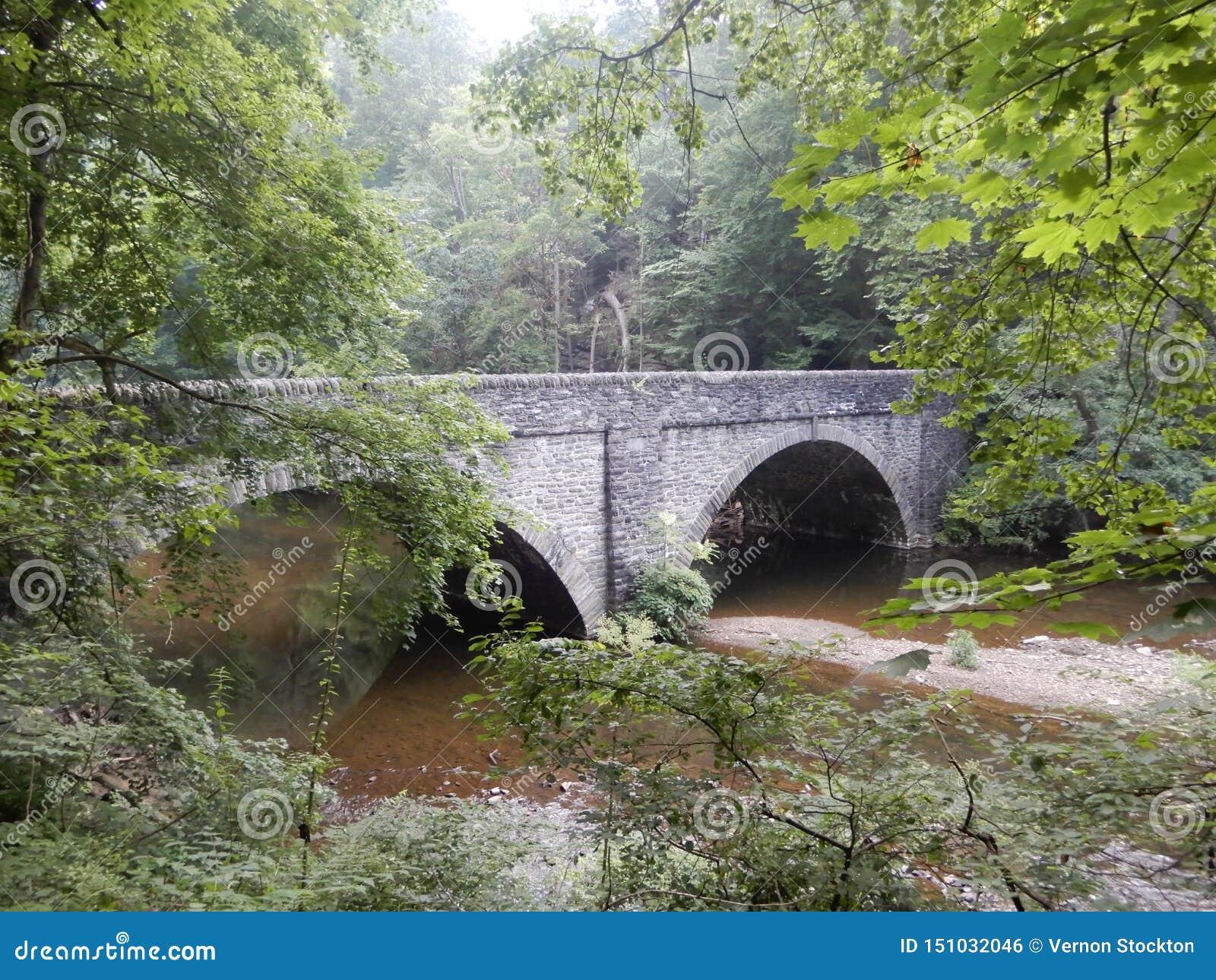 Double Arched Stone Bridge Over Stream from Below Stock Photo - Image ...