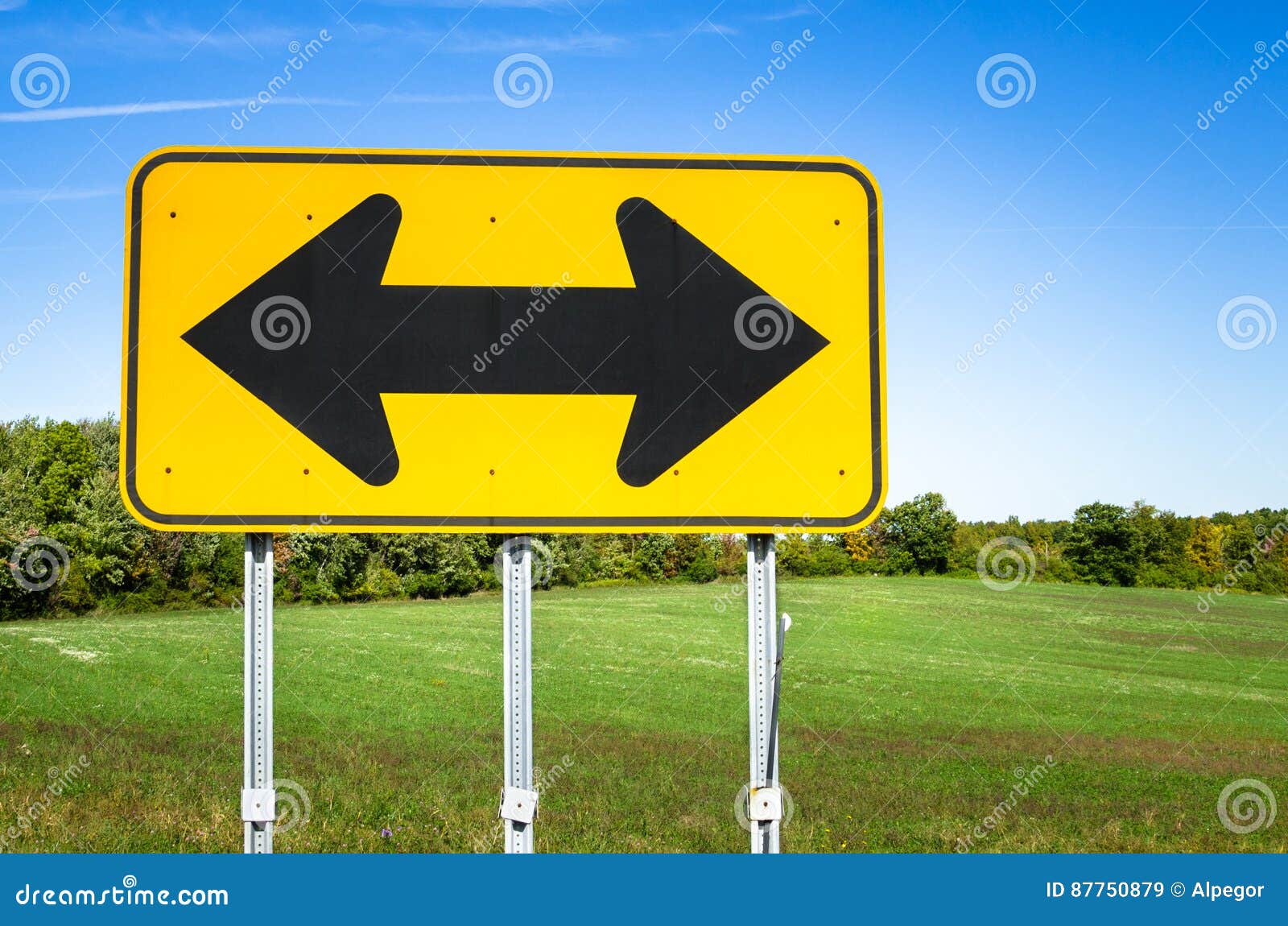 Double Arrow Traffic Sign and Blue Sky Stock Image - Image of sign ...