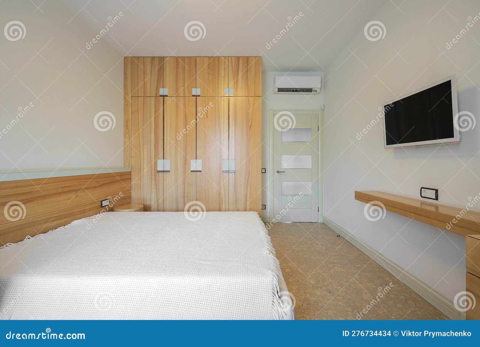 Double Bed with Closet and Tv in the Bedroom Stock Photo - Image of ...