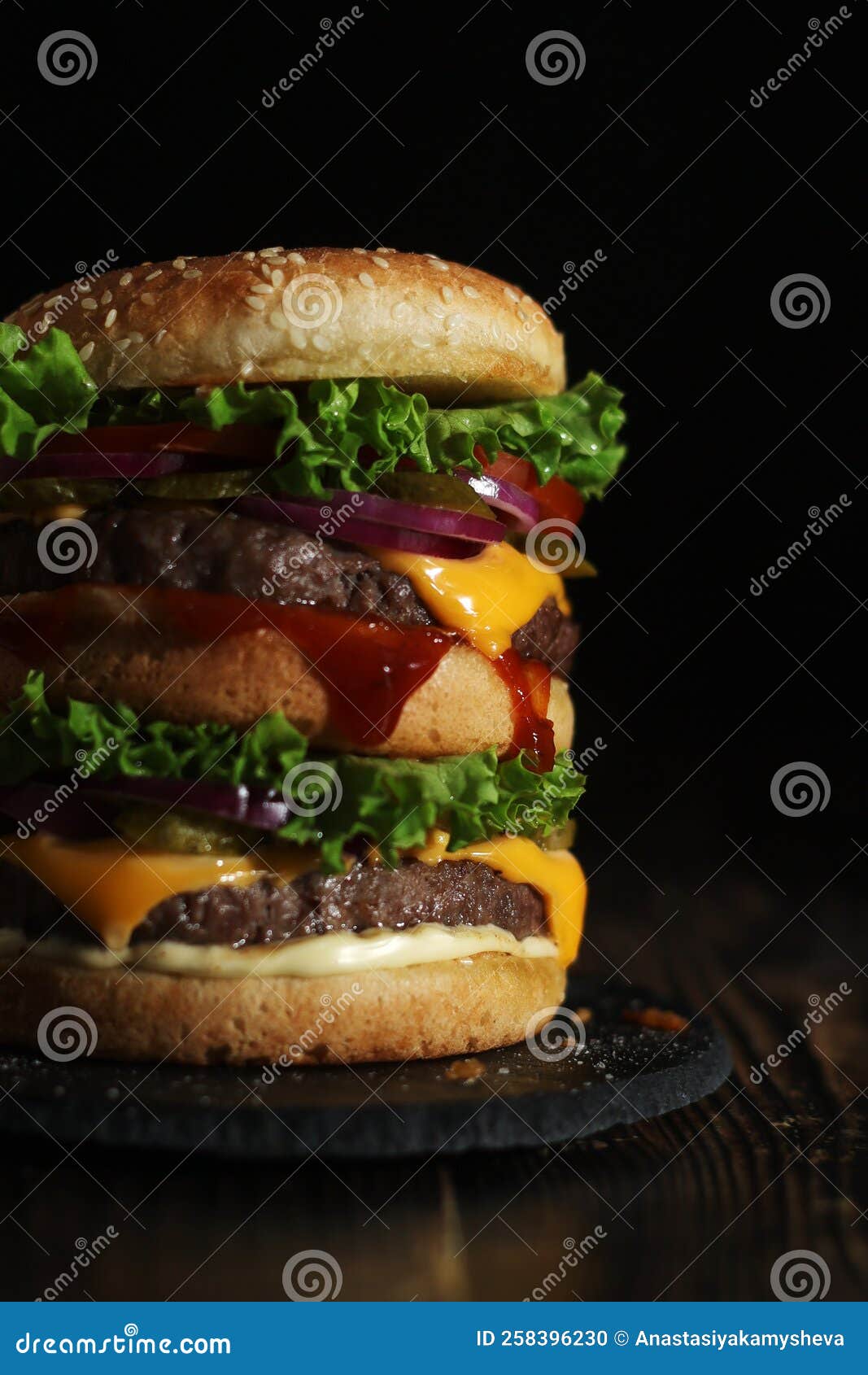 A double burger in low key stock photo. Image of food - 258396230