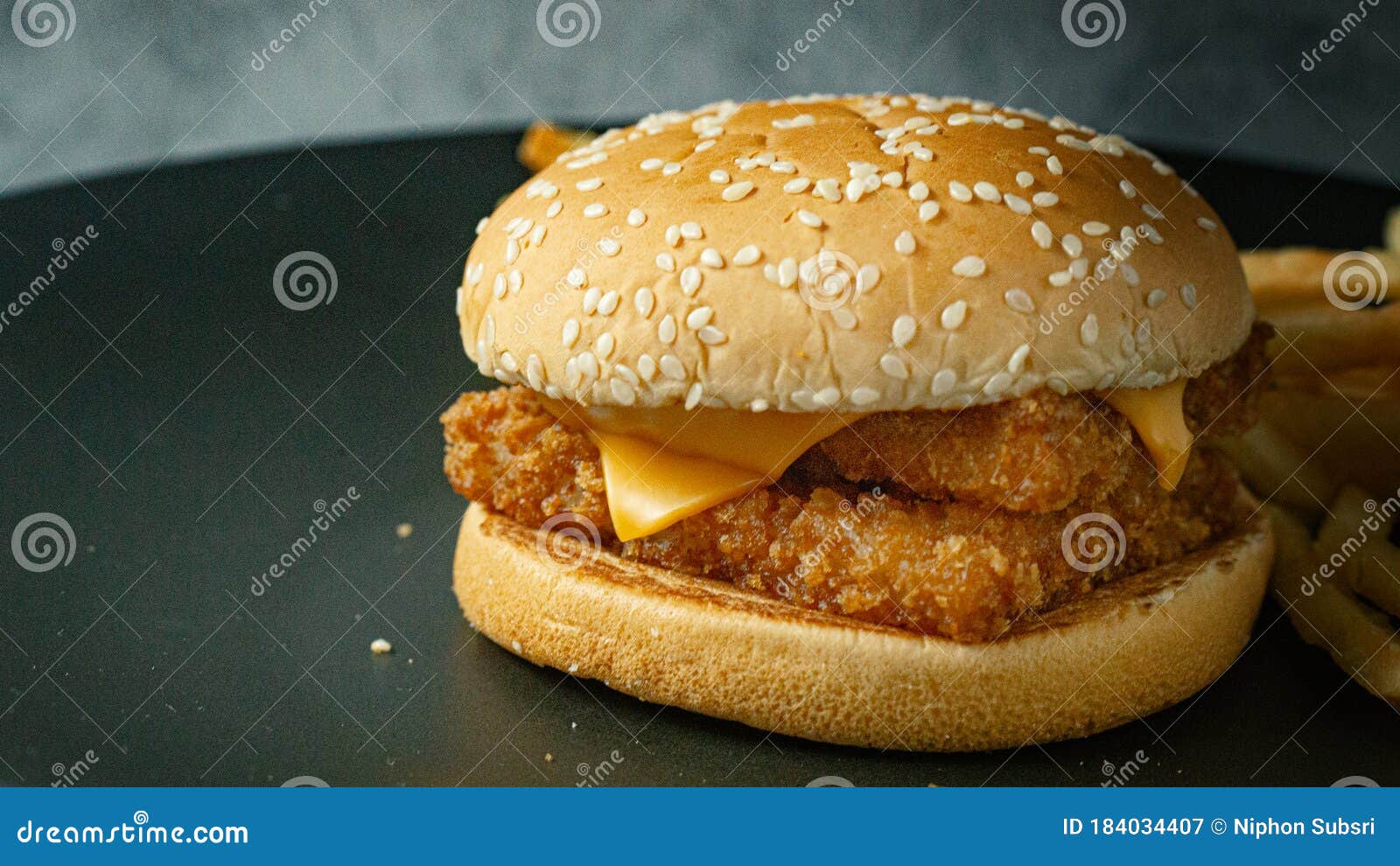 Double Burger Fish on Black Plate for Food Content Stock Image - Image ...