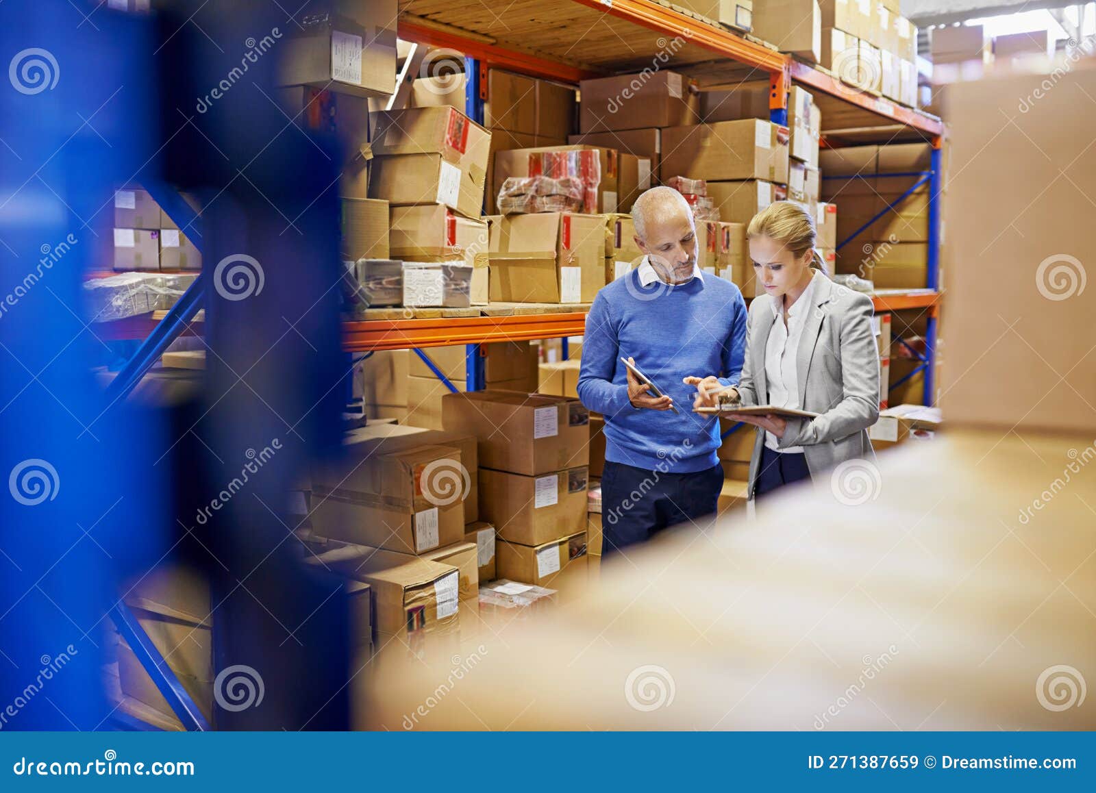 We always Double Check Orders. a Man and Woman Inspecting Inventory in ...