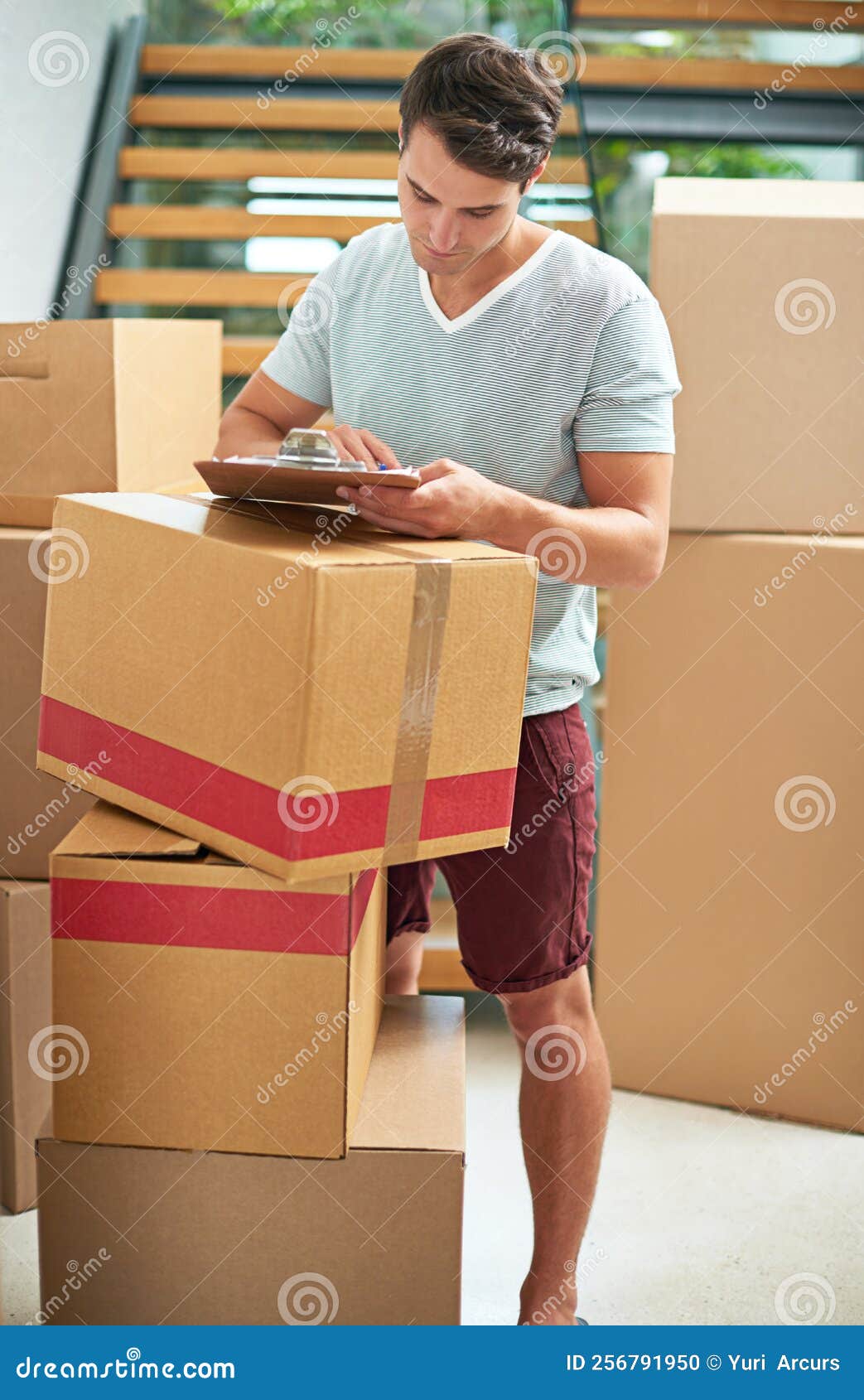 Double-checking that Everything Was Delivered. a Young Man Signing a ...
