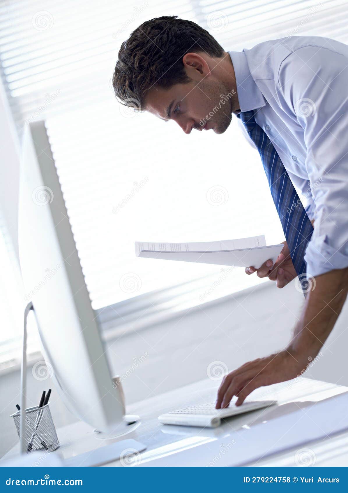 Double-checking the Information Online. a Young Businessman Using a ...