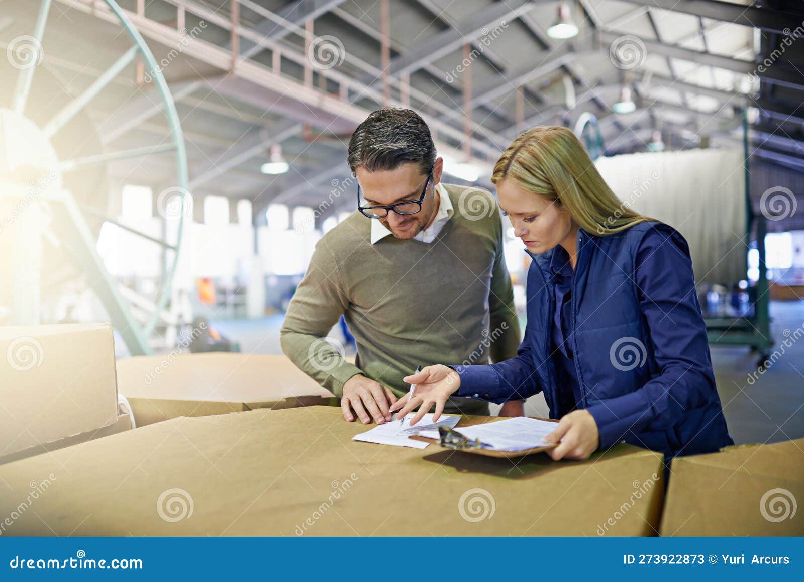 Double Checking the Inventory. a Two Managers Reading Paperwork while ...