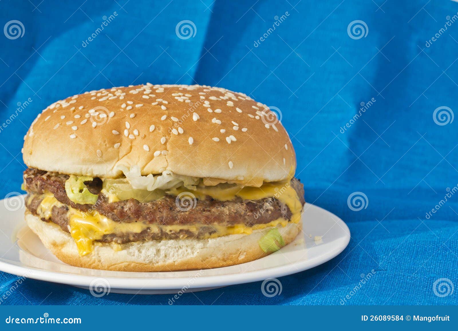 Double Cheeseburger on Blue Linen Background Stock Photo - Image of ...