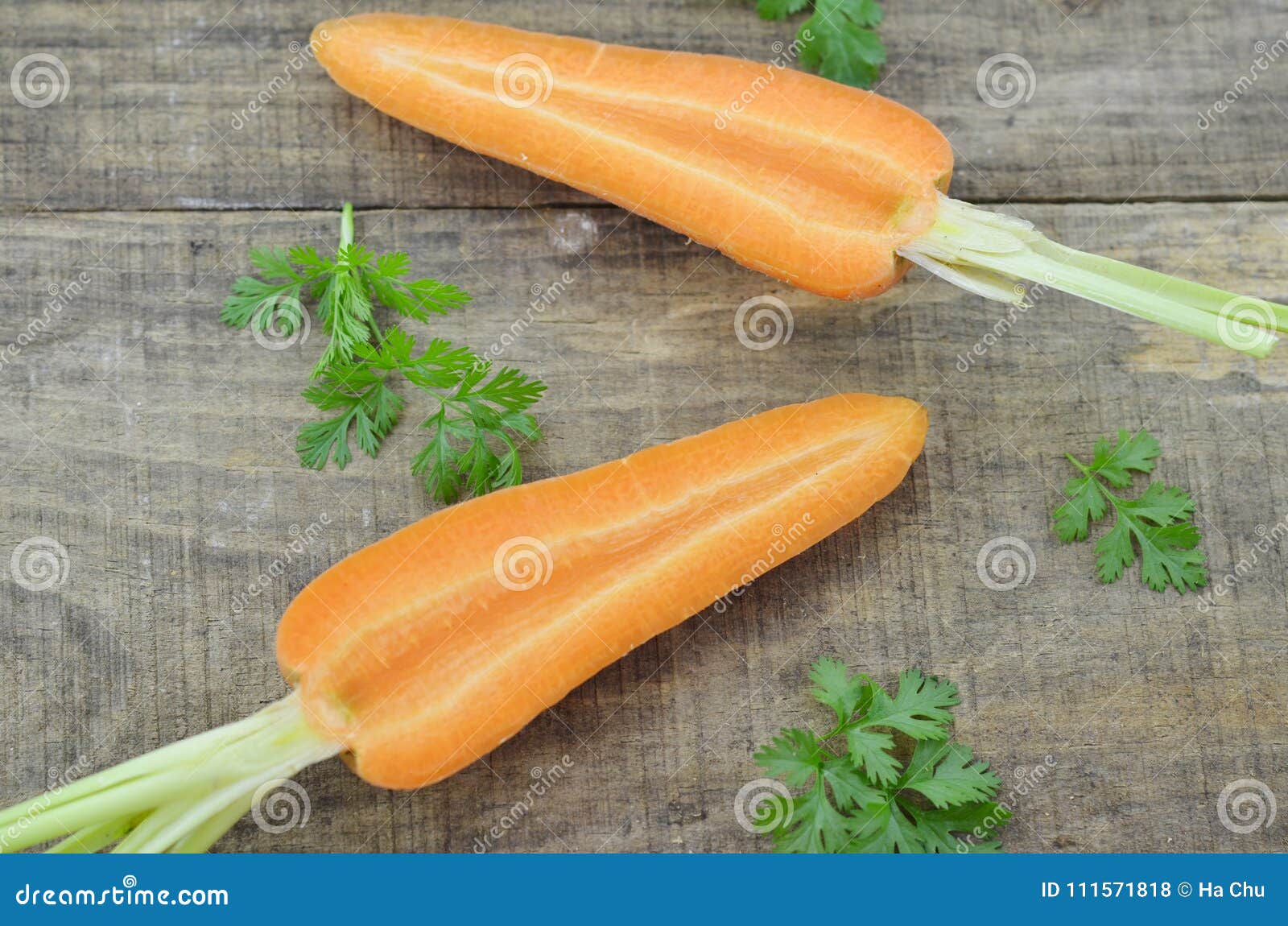 Double Cut Carrot on Wooden Background Stock Photo - Image of ...